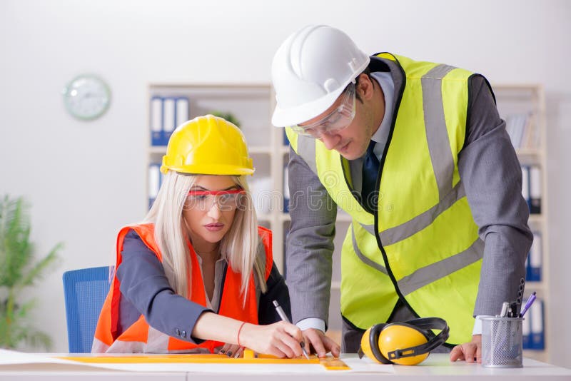 Construction Workers Having Discussion in Office before Starting Stock ...