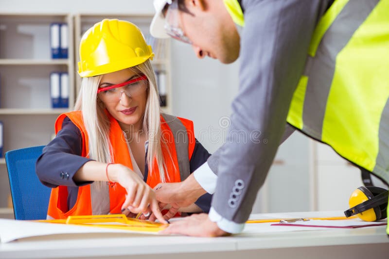 Construction Workers Having Discussion in Office before Starting Stock ...