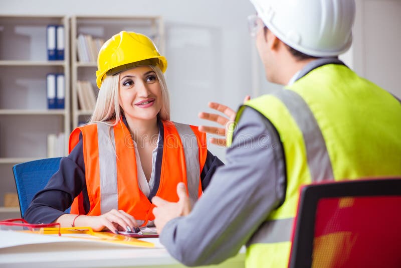 Construction Workers Having Discussion in Office before Starting Stock ...