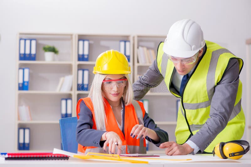 Construction Workers Having Discussion in Office before Starting Stock ...