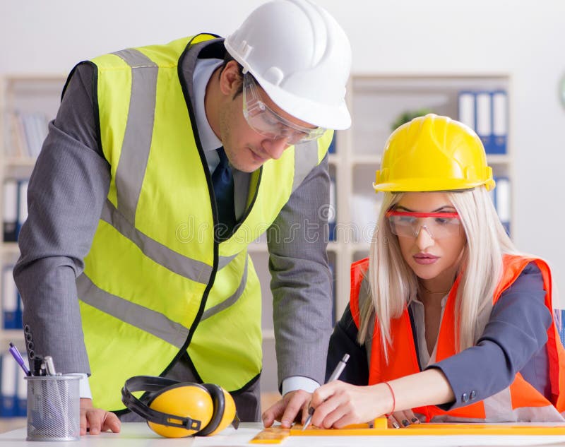 Construction Workers Having Discussion in Office before Starting Stock ...