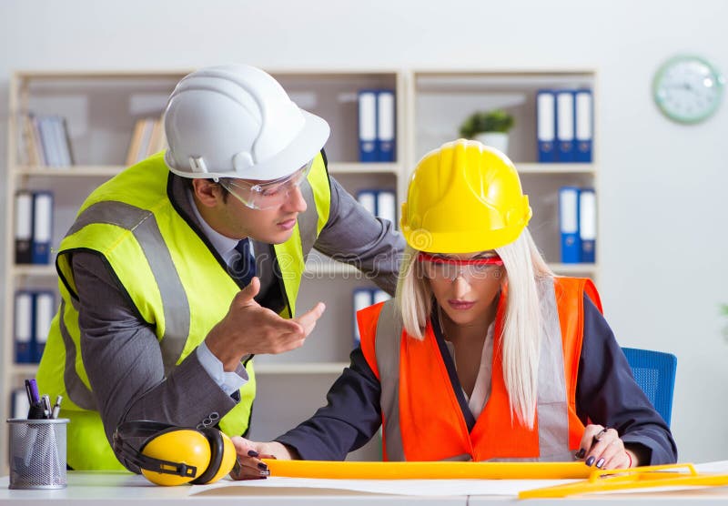 Construction Workers Having Discussion in Office before Starting Stock ...