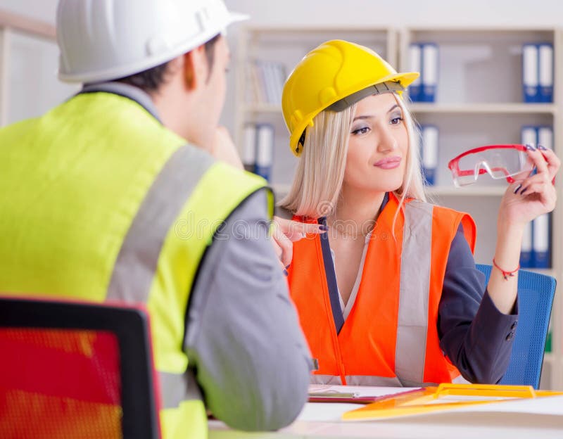 Construction Workers Having Discussion in Office before Starting Stock ...