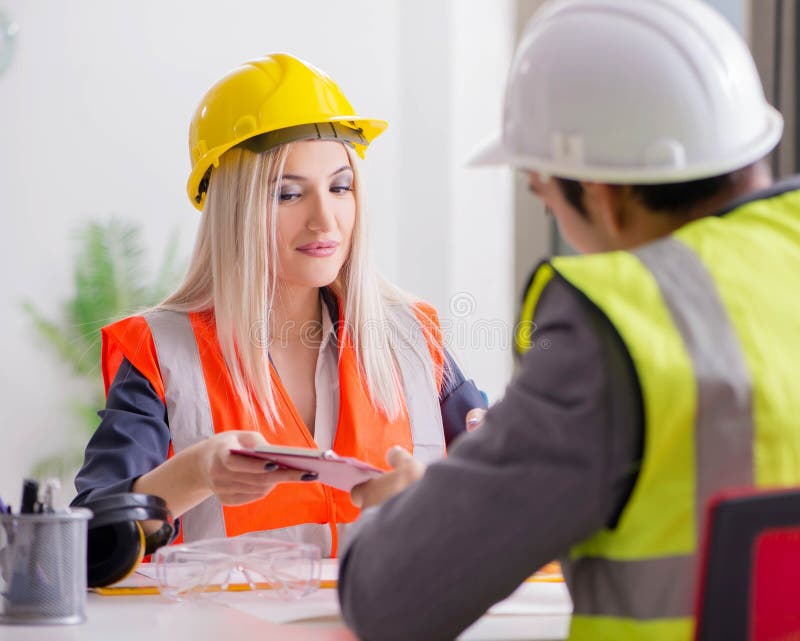 Construction Workers Having Discussion in Office before Starting Stock ...