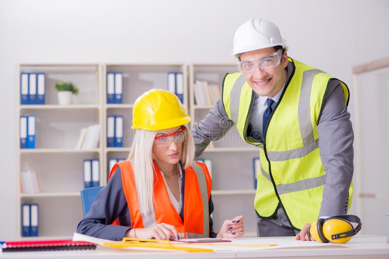 Construction Workers Having Discussion in Office before Starting Stock ...