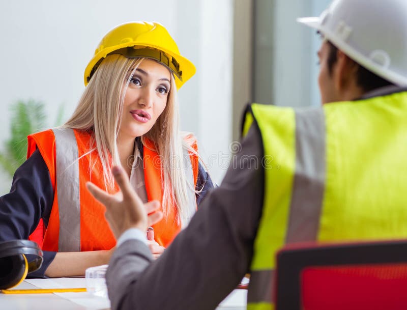 Construction Workers Having Discussion in Office before Starting Stock ...