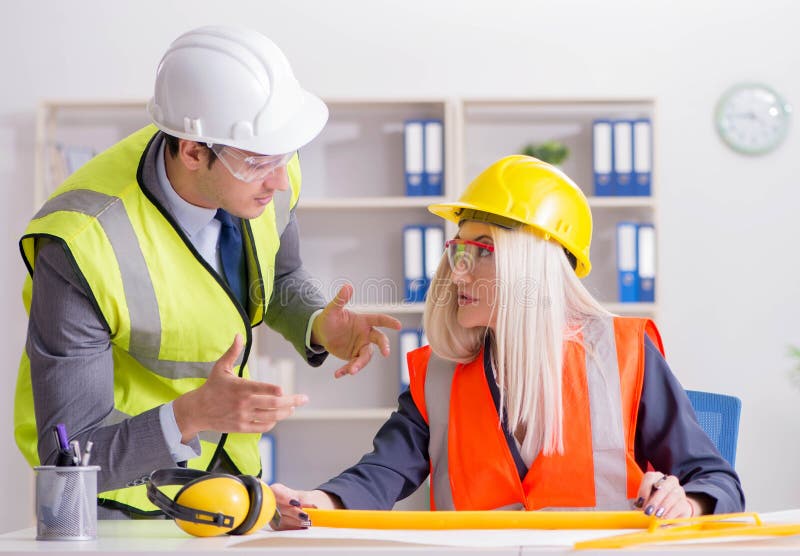 Construction Workers Having Discussion in Office before Starting Stock ...