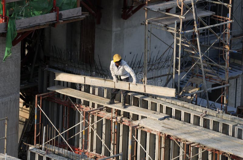 Construction Workers at High-rise Building Stock Photo - Image of ...