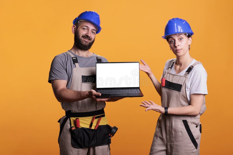 Construction Workers Holding Laptop with White Display Stock Photo ...