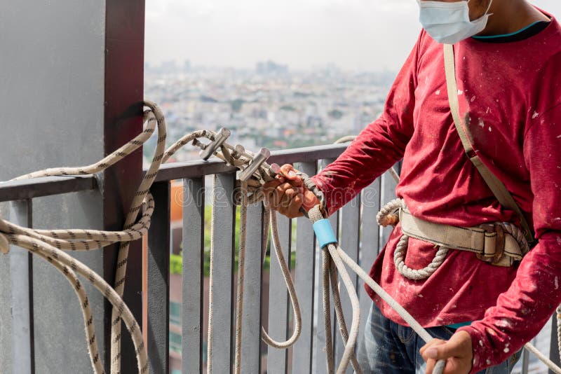 Construction Workers Holding Steel Hooks Connecting with Rope for Self ...