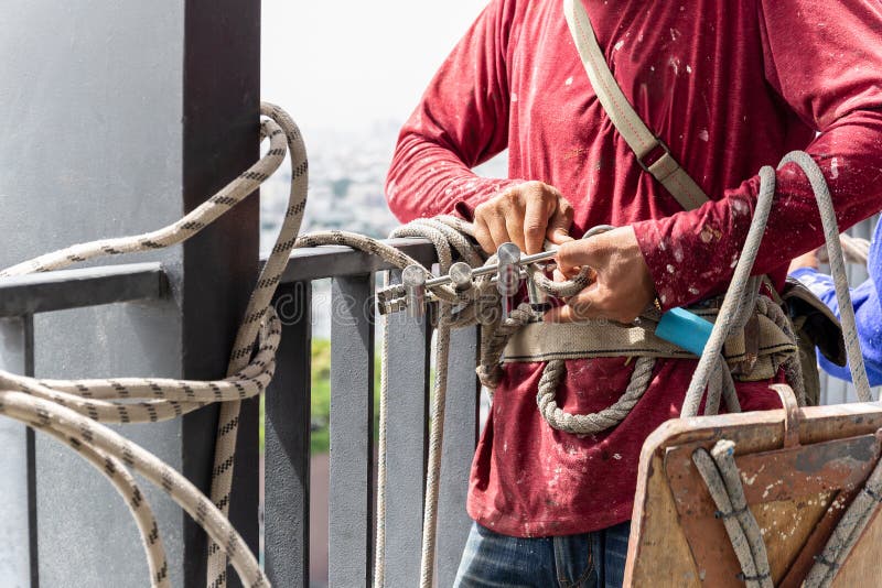 Construction Workers Holding Steel Hooks Connecting with Rope for Self ...