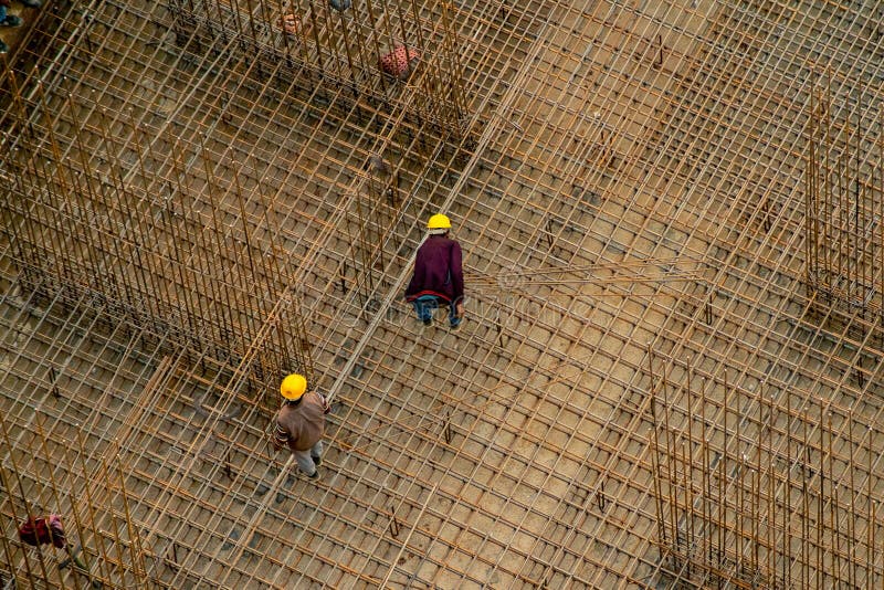 Construction Workers in India Standing on a Rebar Reinforcing Bar ...