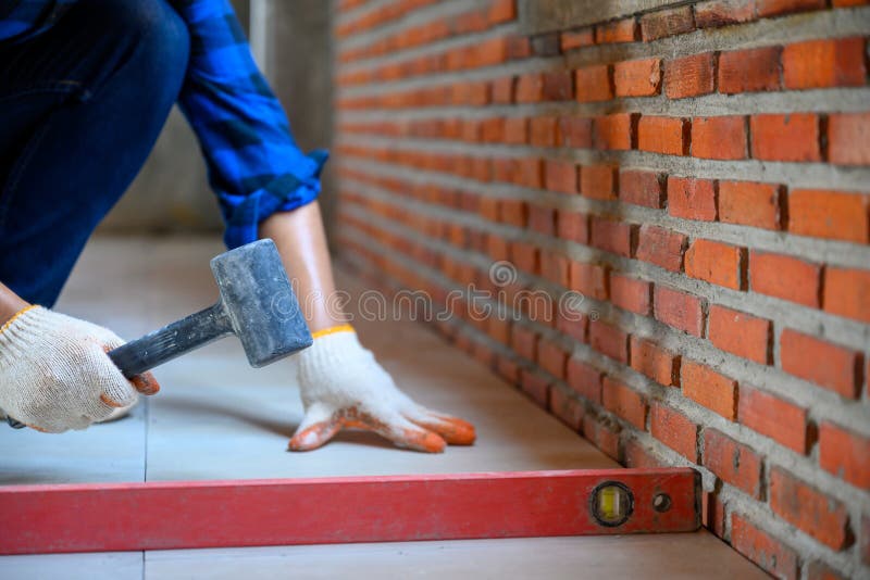 Construction Workers or Industrial Tilers are Working on Ceramic Tile ...