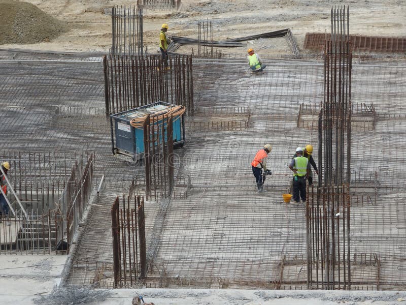 Construction Workers Install Reinforcement Bars at the Construction ...