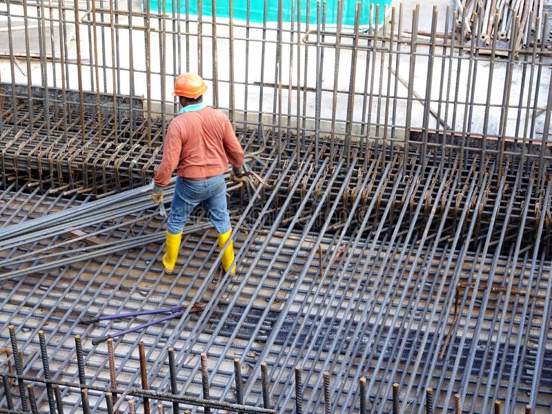 Construction Workers Install Reinforcement Bars at the Construction ...