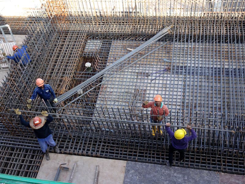 Construction Workers Install Reinforcement Bars at the Construction ...