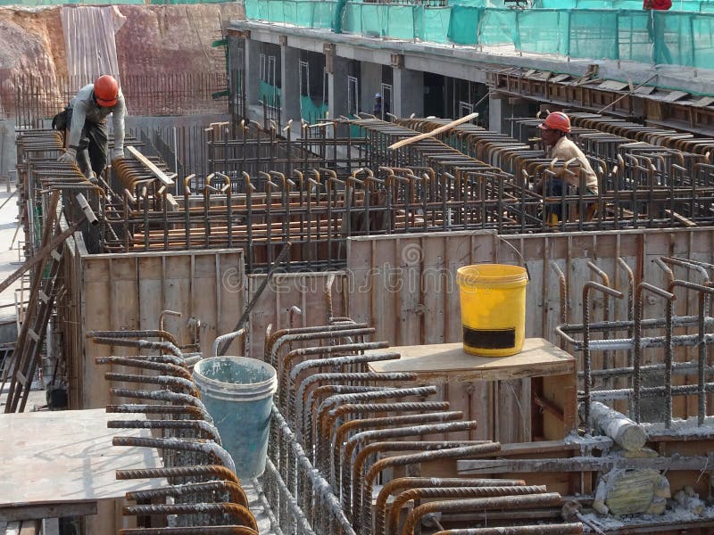 Construction Workers Install Reinforcement Bars at the Construction ...