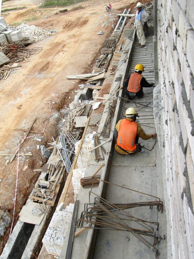 Construction Workers Install Reinforcement Bars at the Construction ...