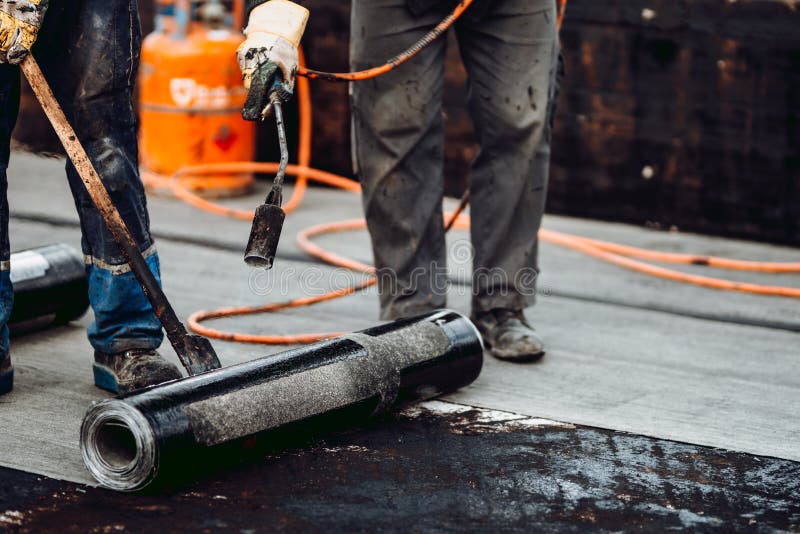 Construction Workers Installing Bituminous Membrane Waterproofing ...