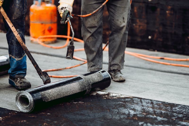 Construction Workers Installing Bituminous Membrane Waterproofing ...
