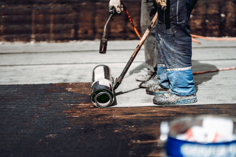 Construction Workers Installing Bituminous Membrane Waterproofing ...