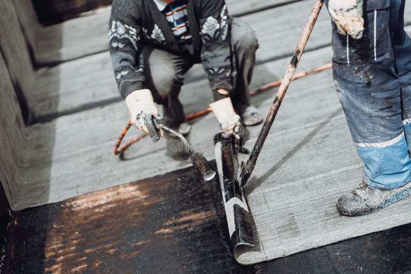 Construction Workers Installing Bituminous Membrane Waterproofing ...
