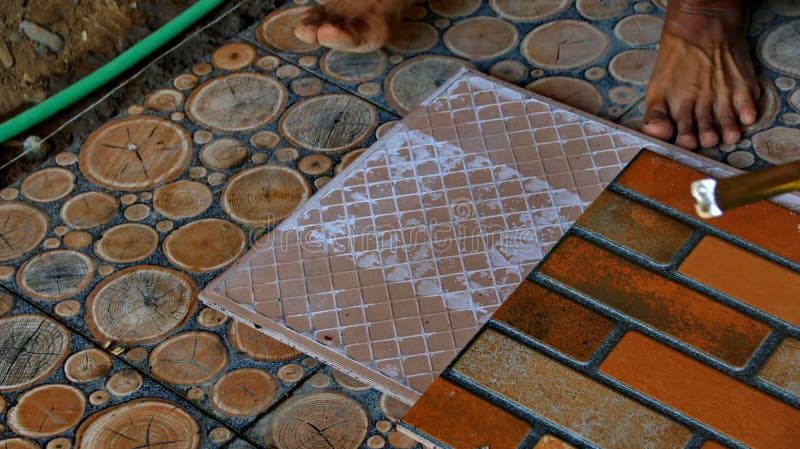 Construction Workers when Installing Ceramic Tiles for Floors Stock ...