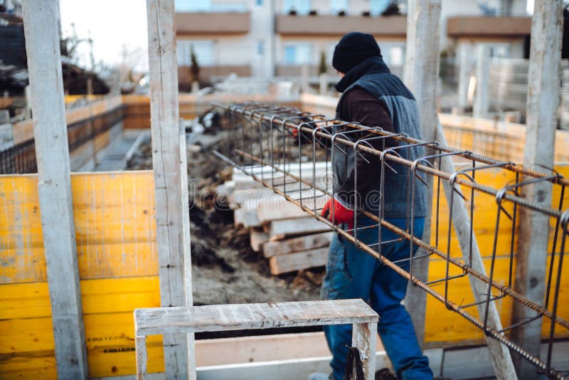 Construction Workers Installing Metal Bars, Reinforced Steel Stock ...