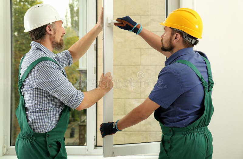 Construction Workers Installing New Window Stock Photo - Image of ...