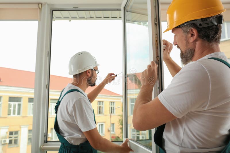 Construction Workers Installing New Window Stock Photo - Image of build ...