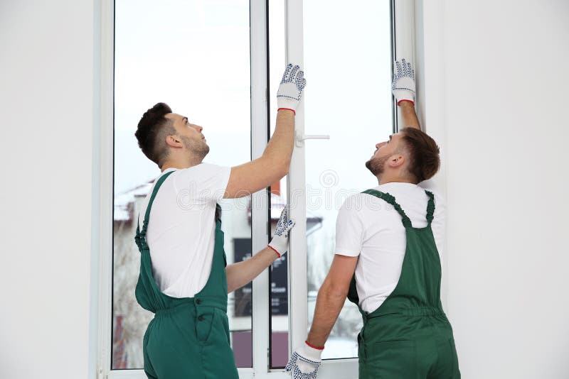 Construction Workers Carrying Window Glass Stock Image - Image of ...