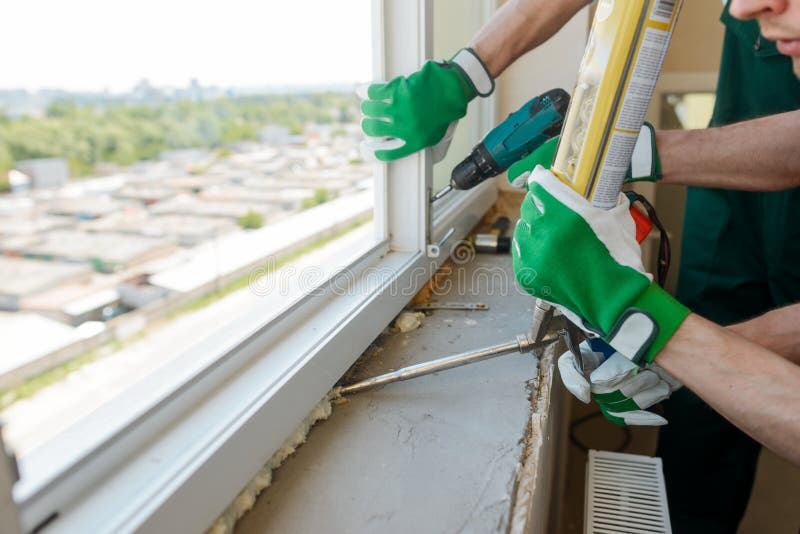 Construction Workers Install a Window Stock Photo - Image of repair ...