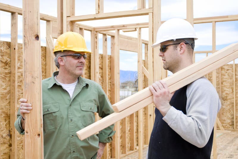 Construction Workers on the Job Building a Home Stock Photo - Image of ...