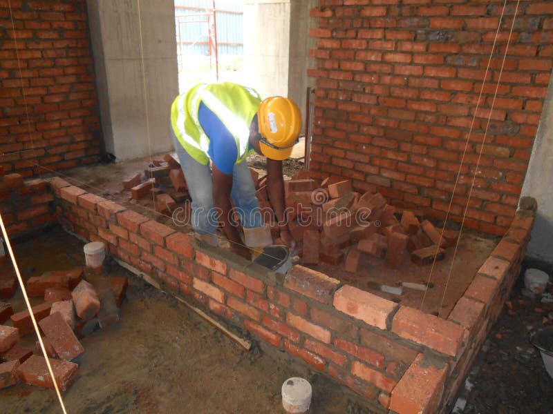 Construction Workers Laying Bricks at Construction Site Editorial ...