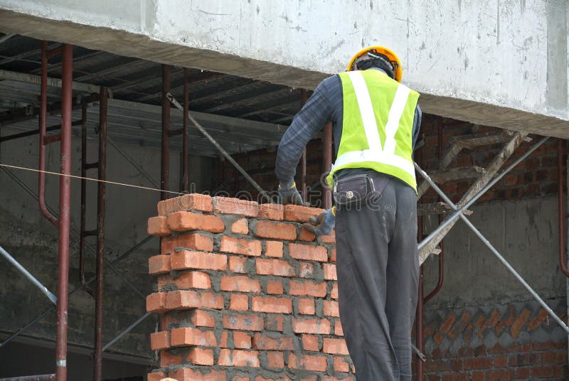Construction Workers Laying Bricks at Construction Site Editorial Image ...
