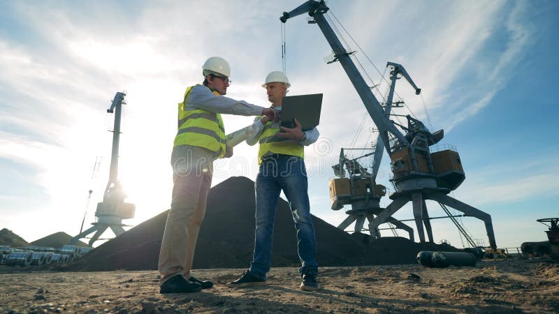 Construction Workers with Layouts are Talking at the Mining Site Stock ...