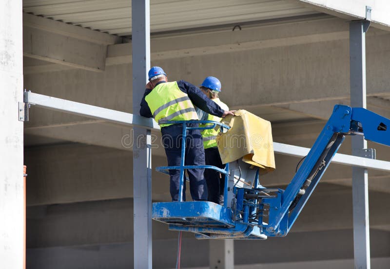 Construction Workers in Lifting Cage Editorial Photography - Image of ...