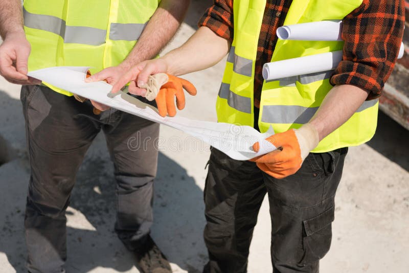 Construction Workers Looking at Blueprints Stock Image - Image of ...
