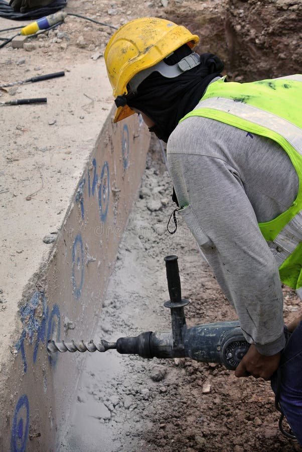 Construction Workers Make Holes at the Concrete Wall Editorial Image ...