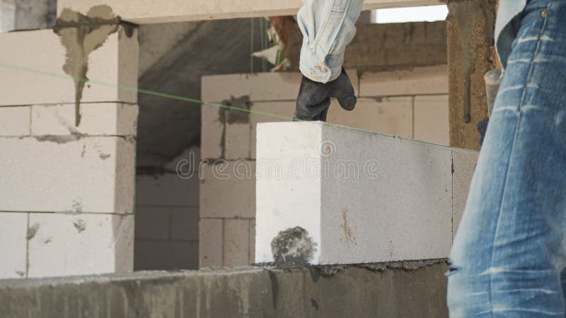 Construction Workers are Making White Lightweight Concrete Blocks that ...