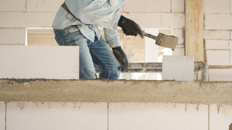 Construction Workers are Making White Lightweight Concrete Blocks that ...