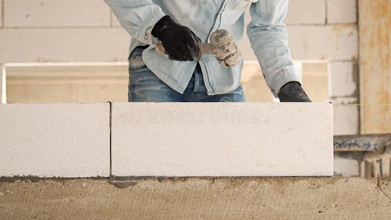 Construction Workers are Making White Lightweight Concrete Blocks that ...