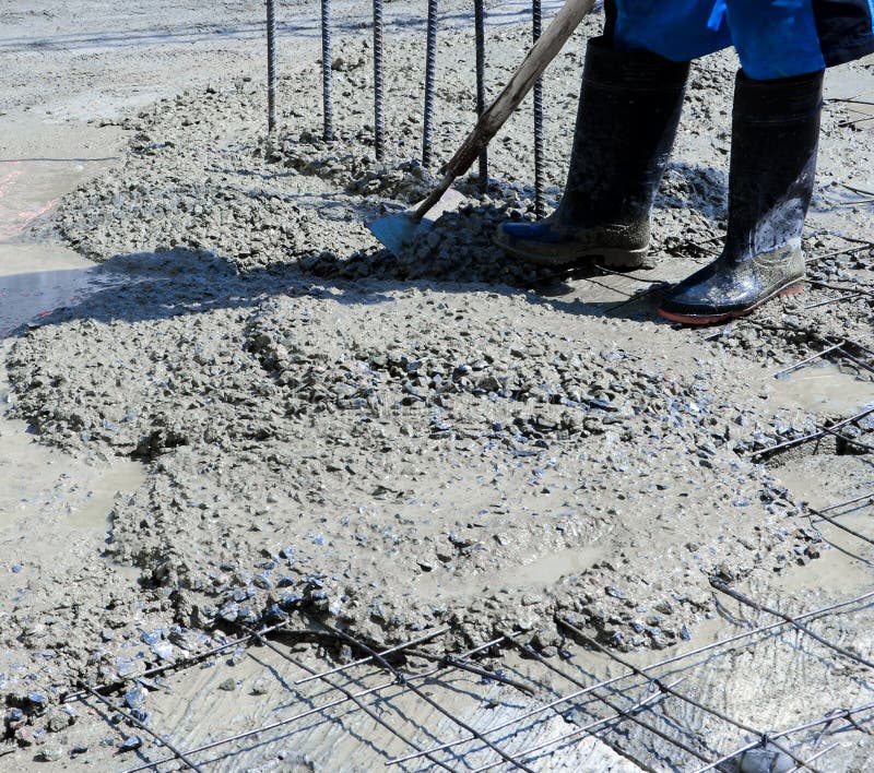 Construction Workers Smooth Out the Floor of the Building. Stock Image ...