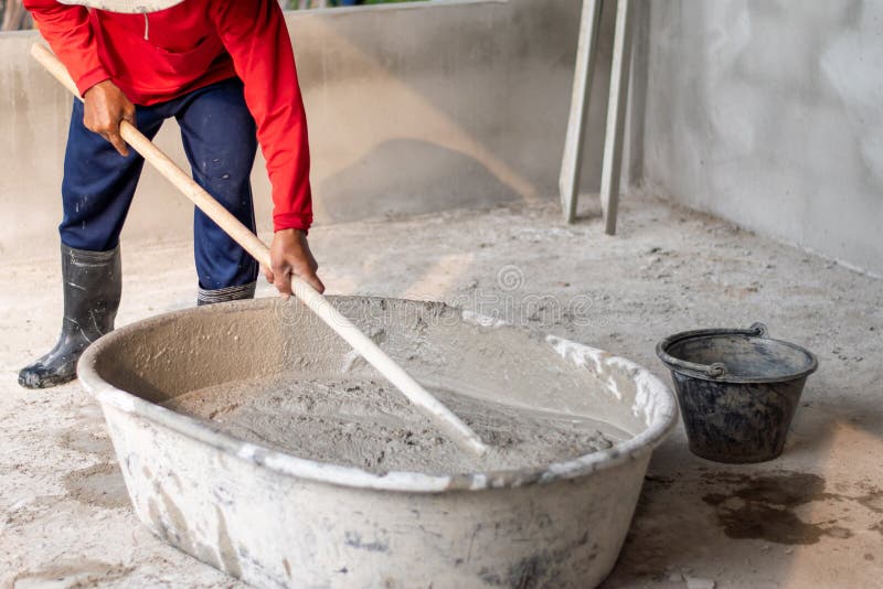 Construction Workers are Mixing Cement in the Construction Site Stock ...