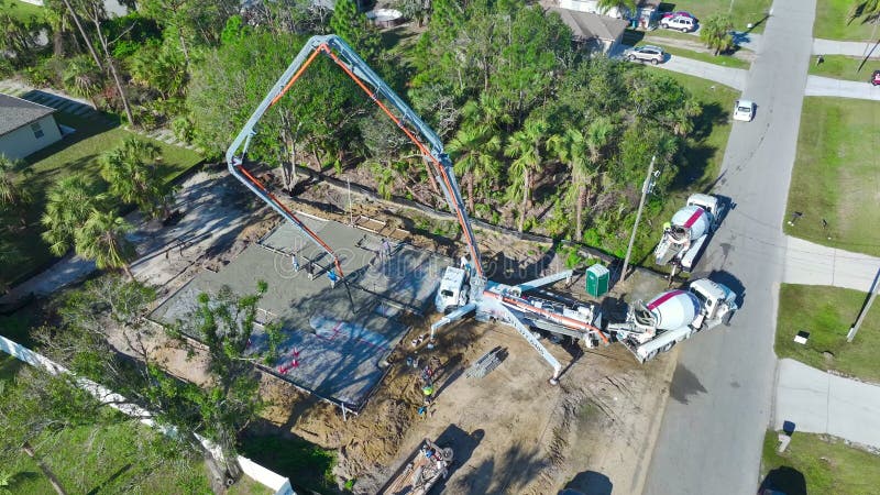 Construction Workers at New House Building Site Pouring Concrete of ...