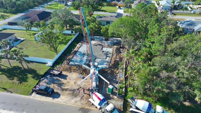 Construction Workers at New House Building Site Pouring Concrete of ...