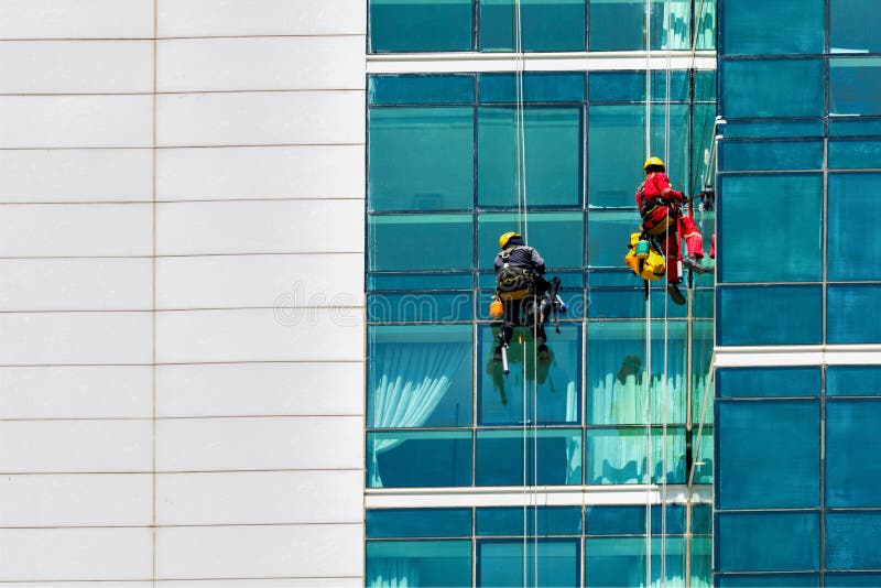 Construction Workers Performing Maintenance or Repair on the Facade of ...