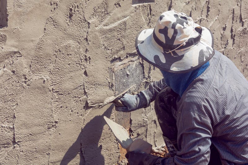 Construction Workers Plastering Building Wall Using Cement Plaster ...