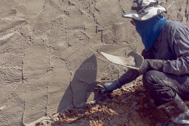 Construction Workers Plastering Building Wall Using Cement Plaster ...