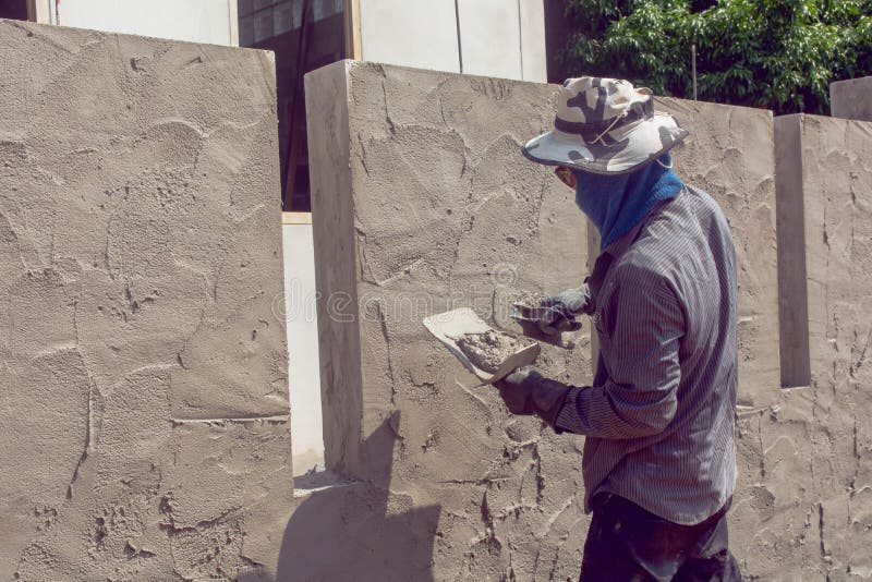 Construction Workers Plastering Building Wall Using Cement Plaster ...